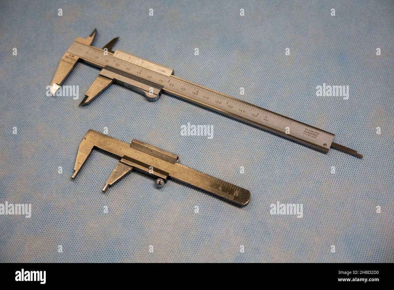 two calipers of different sizes lie next to each other Stock Photo - Alamy