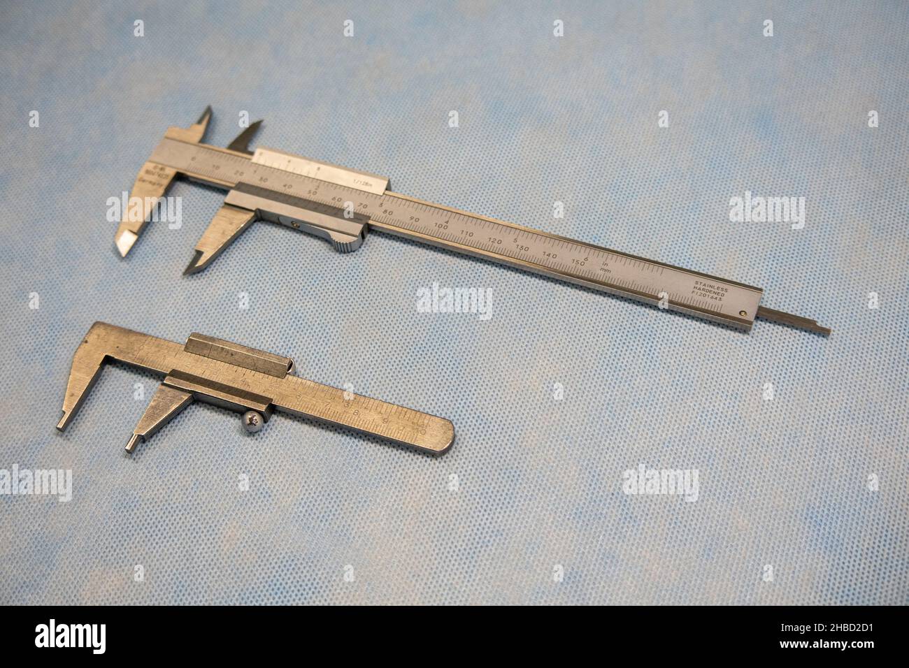 two calipers of different sizes lie next to each other Stock Photo - Alamy