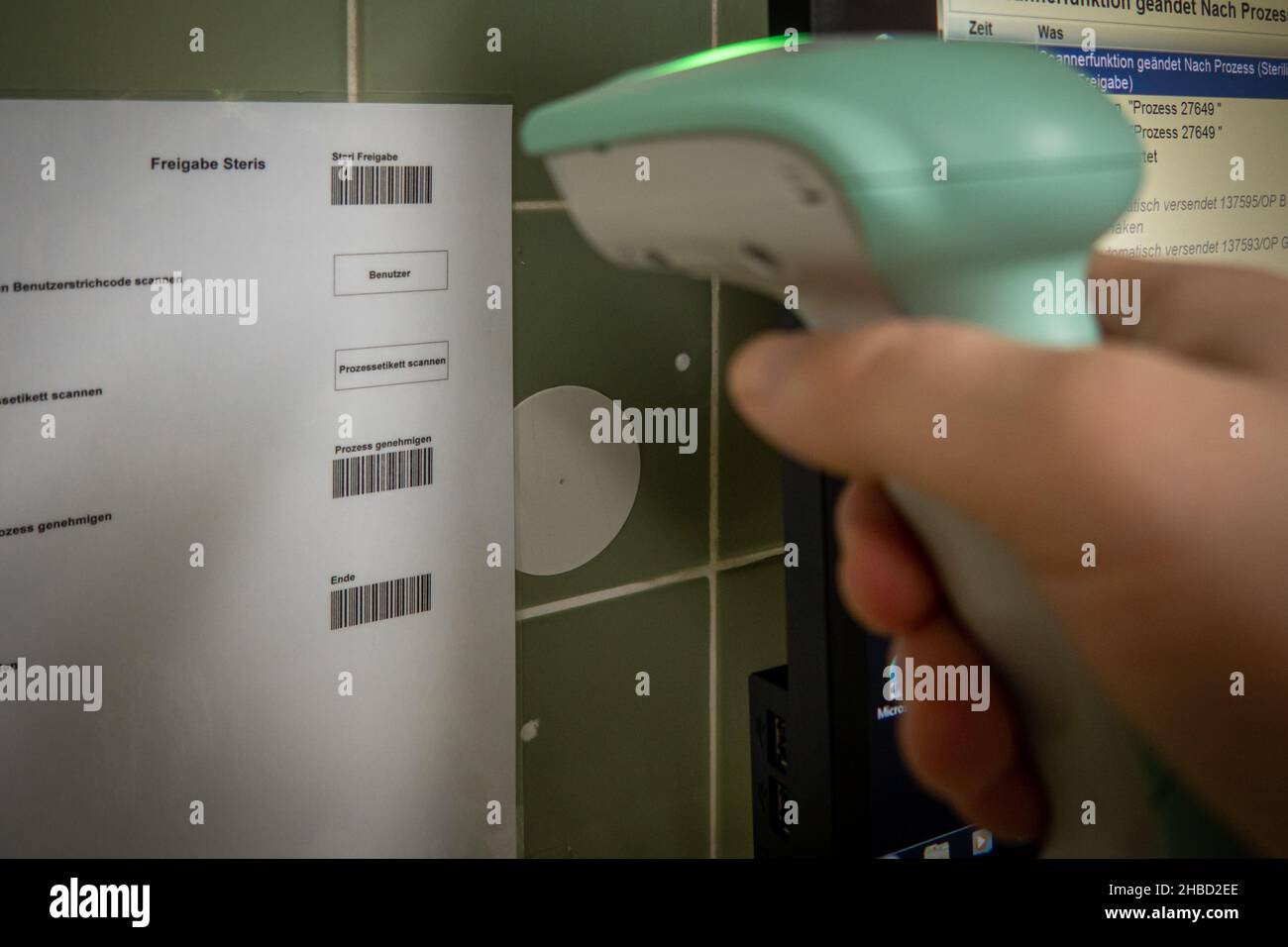 a barcode is scanned with a barcode scanner Stock Photo - Alamy