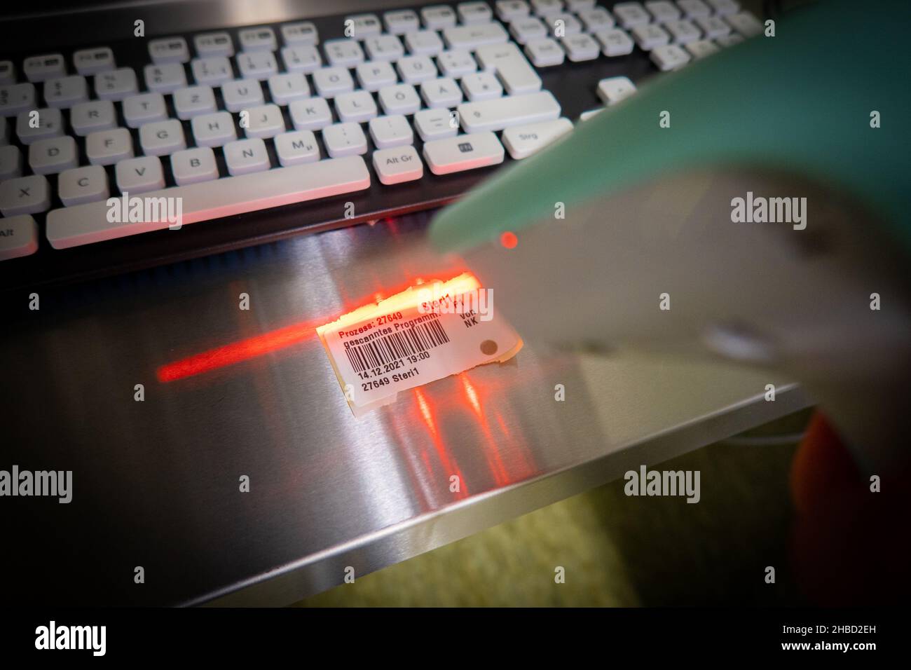 a barcode is scanned with a barcode scanner Stock Photo - Alamy