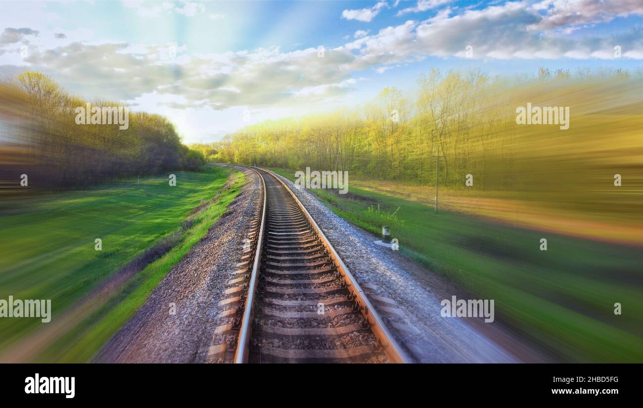 Railway track with motion blur effect. Blurred railway Stock Photo - Alamy
