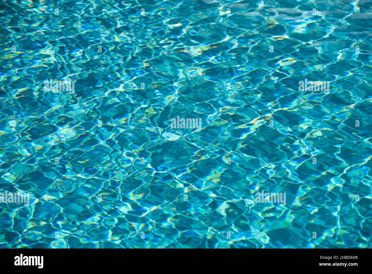 Background of blue water in swimming pool with sun reflection, ripple ...
