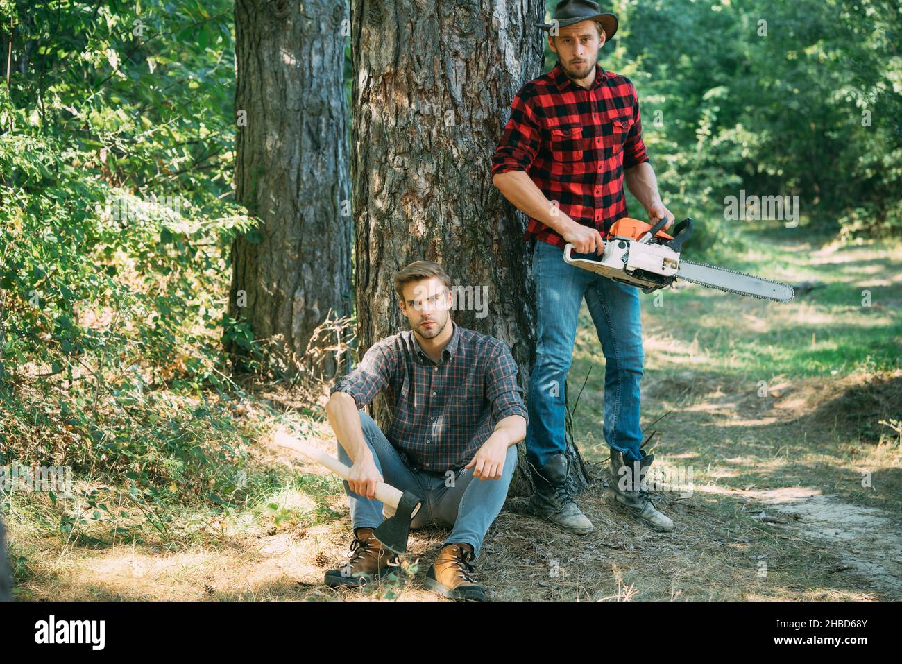 Brutal lumberjacks. Cutting wood. Brutality and masculinity. Lumberjack ...