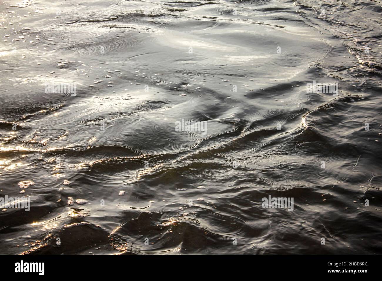 Beautiful sunlight reflections on water surface during sunset Stock ...