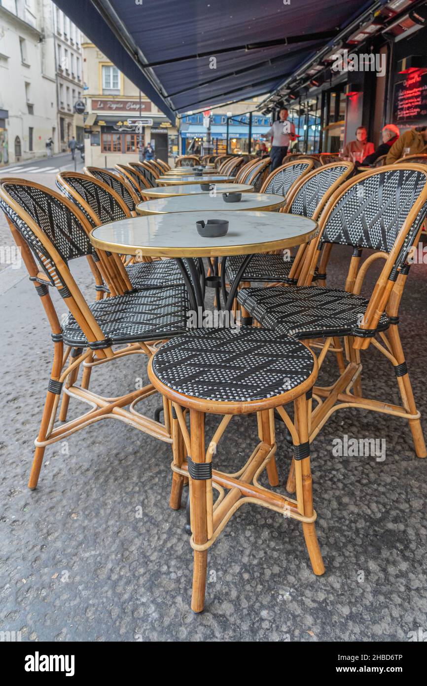 Paris, France - 11 15 2021: Typical bistro terrace table and chair ...