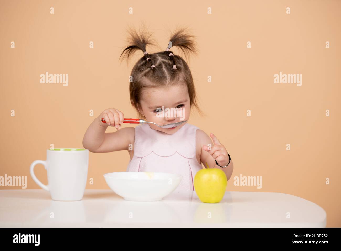 Baby food, babies eating. Healthy nutrition for kids. Funny child face ...