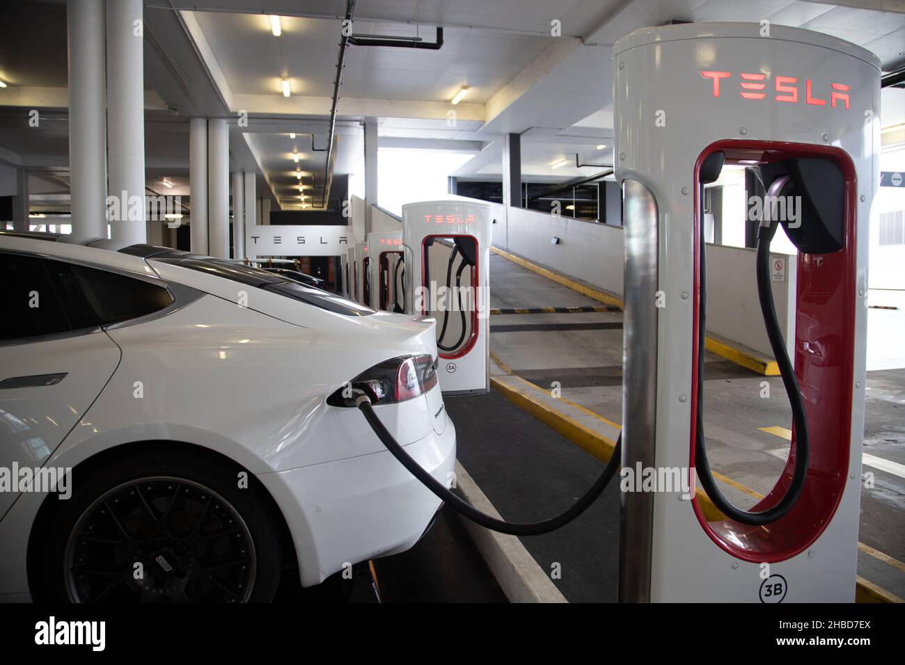 Pacific Fair Shopping Centre Tesla charging station with car Stock ...