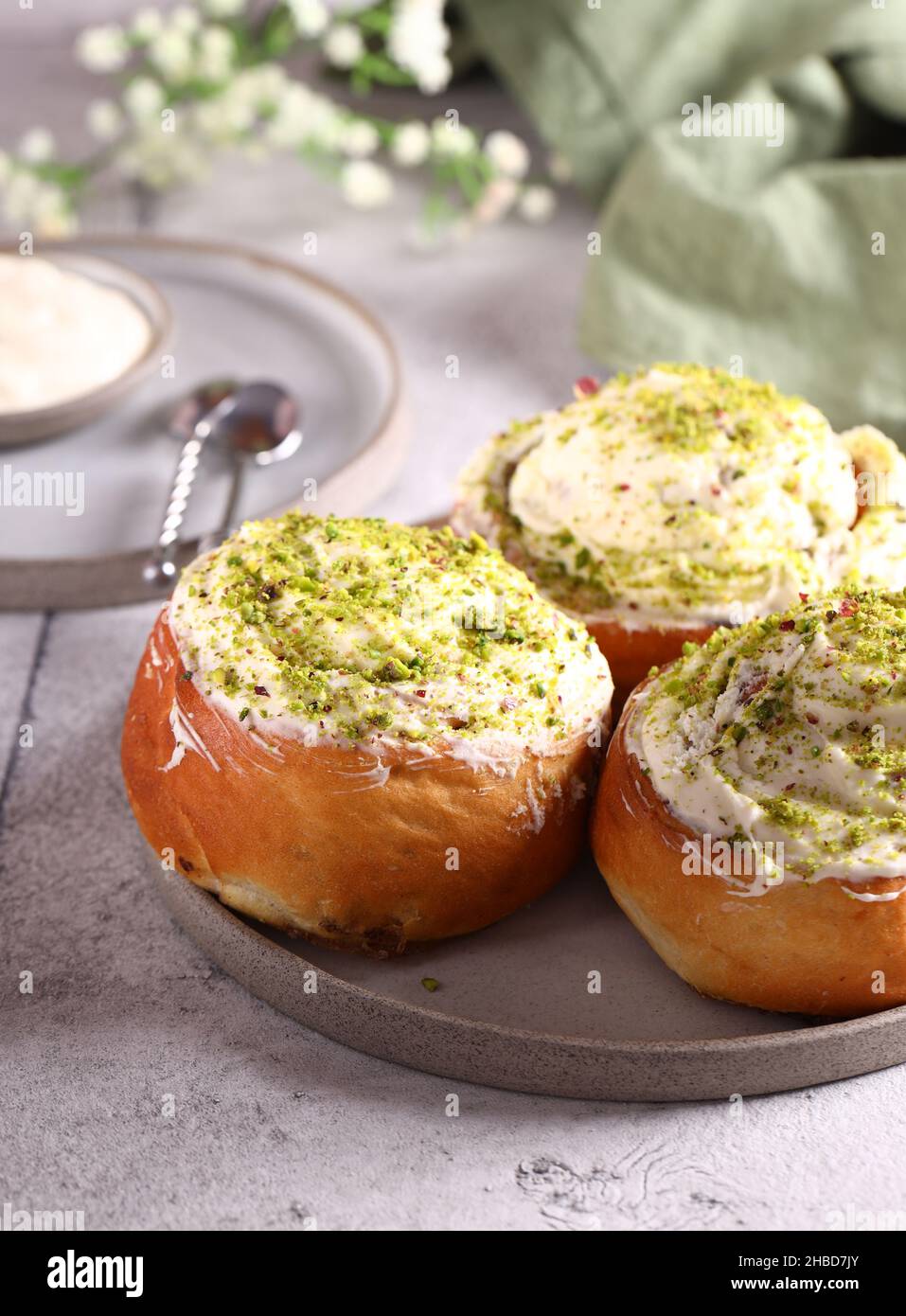 traditional cinnamon buns with icing Stock Photo - Alamy