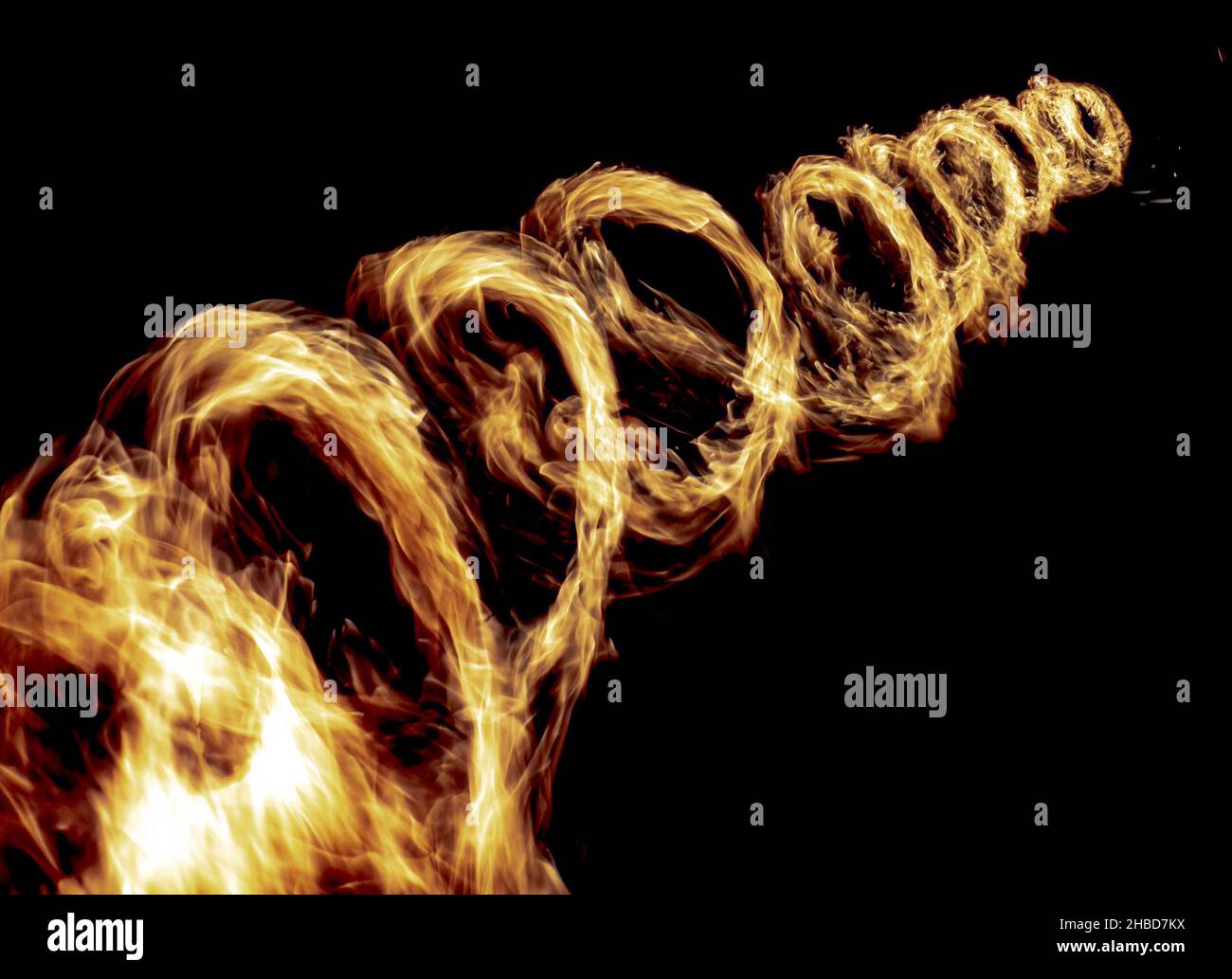 An abstract background of swing fire flame sign isolated on a black ...