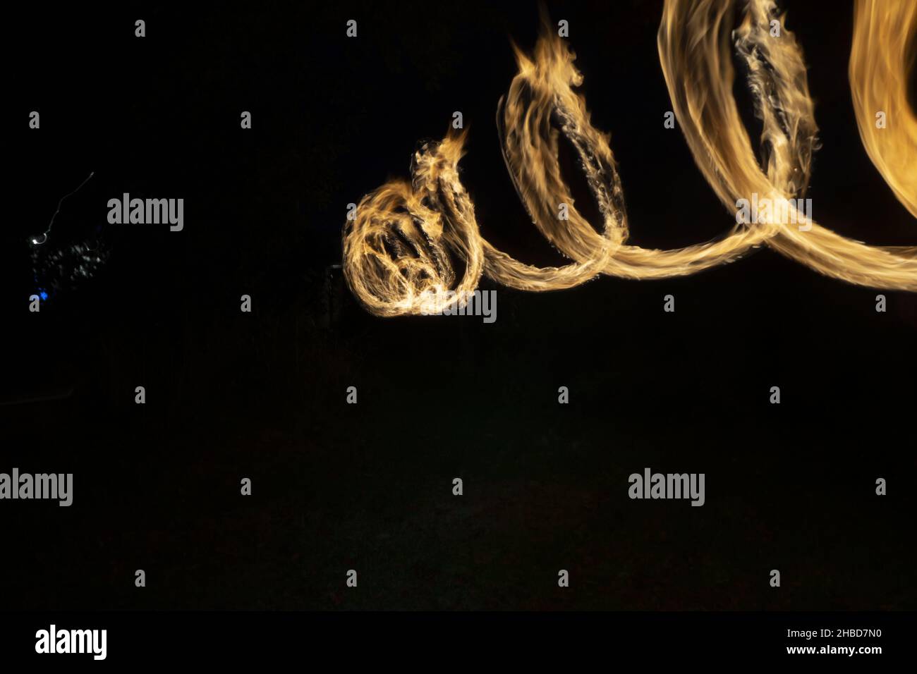An abstract background of swing fire flame sign isolated on a black ...
