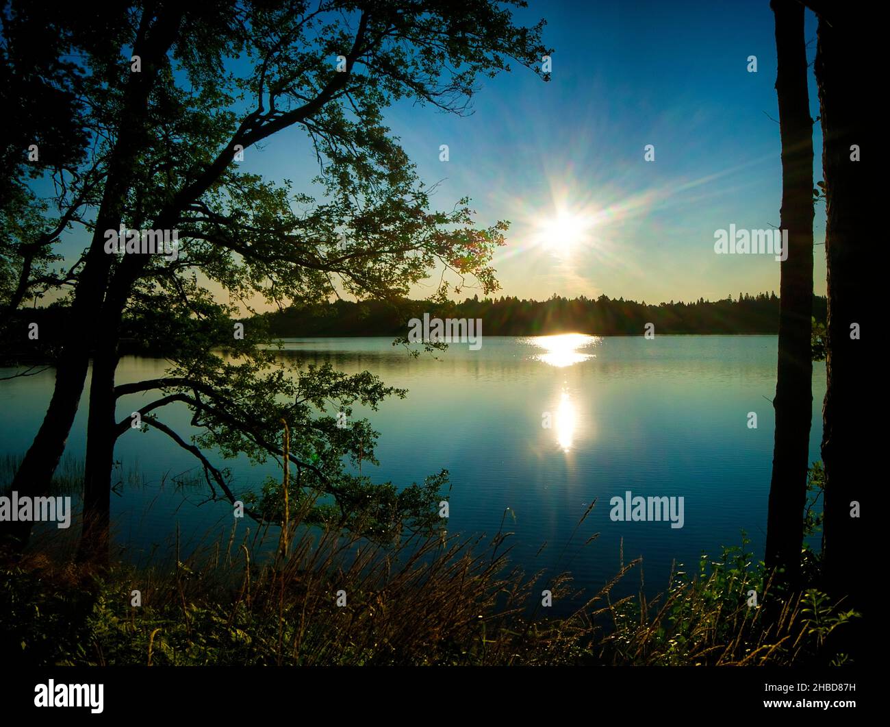 Dramatic Lithuanian lake Plateliai sunrise romantic shot. Blue lake ...