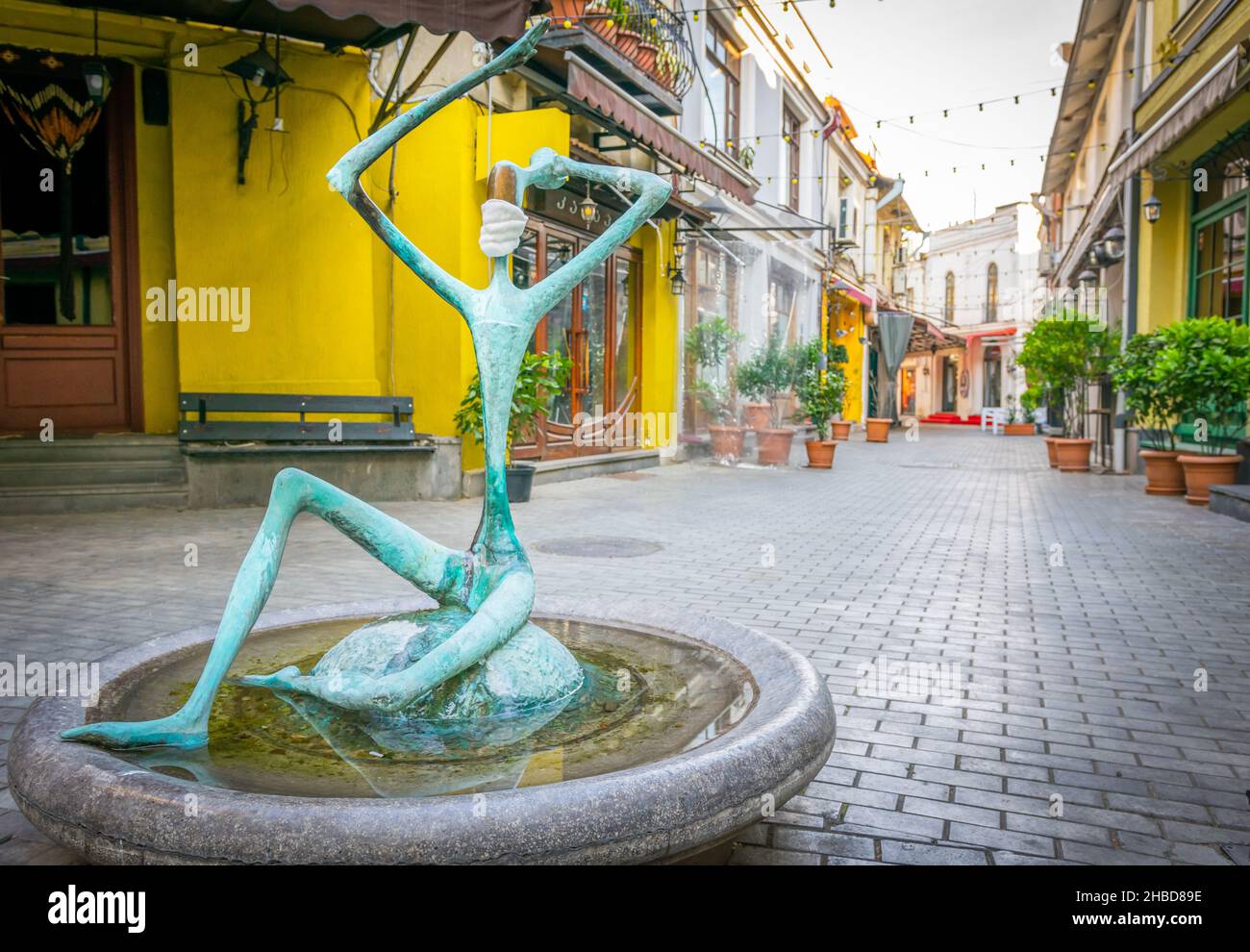 Statue with surgical face mask on and empty pathway without tourists ...