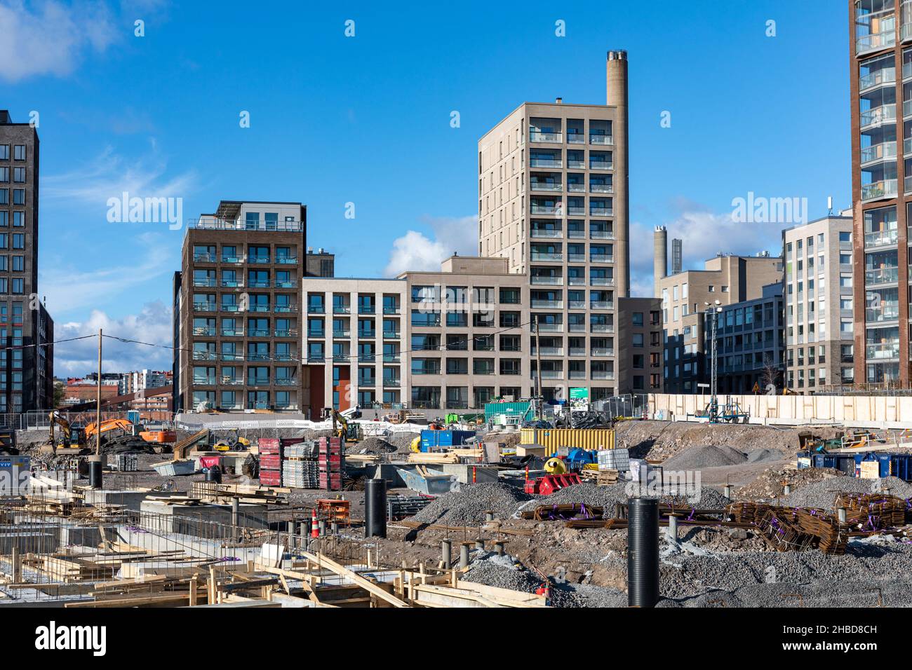 Newly built residential buildings behind construction site lot in ...