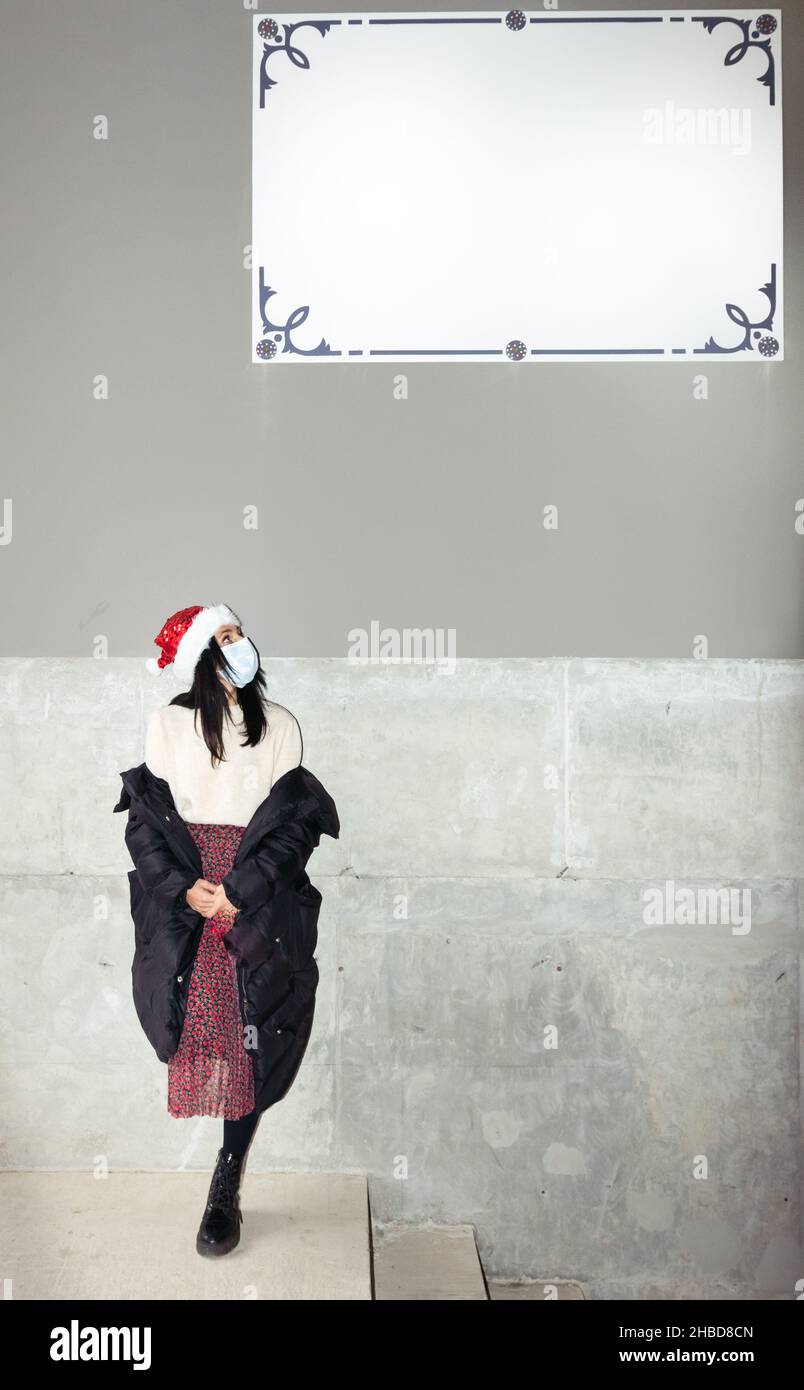 Creative background of woman standing and llay to wall and look up to ...
