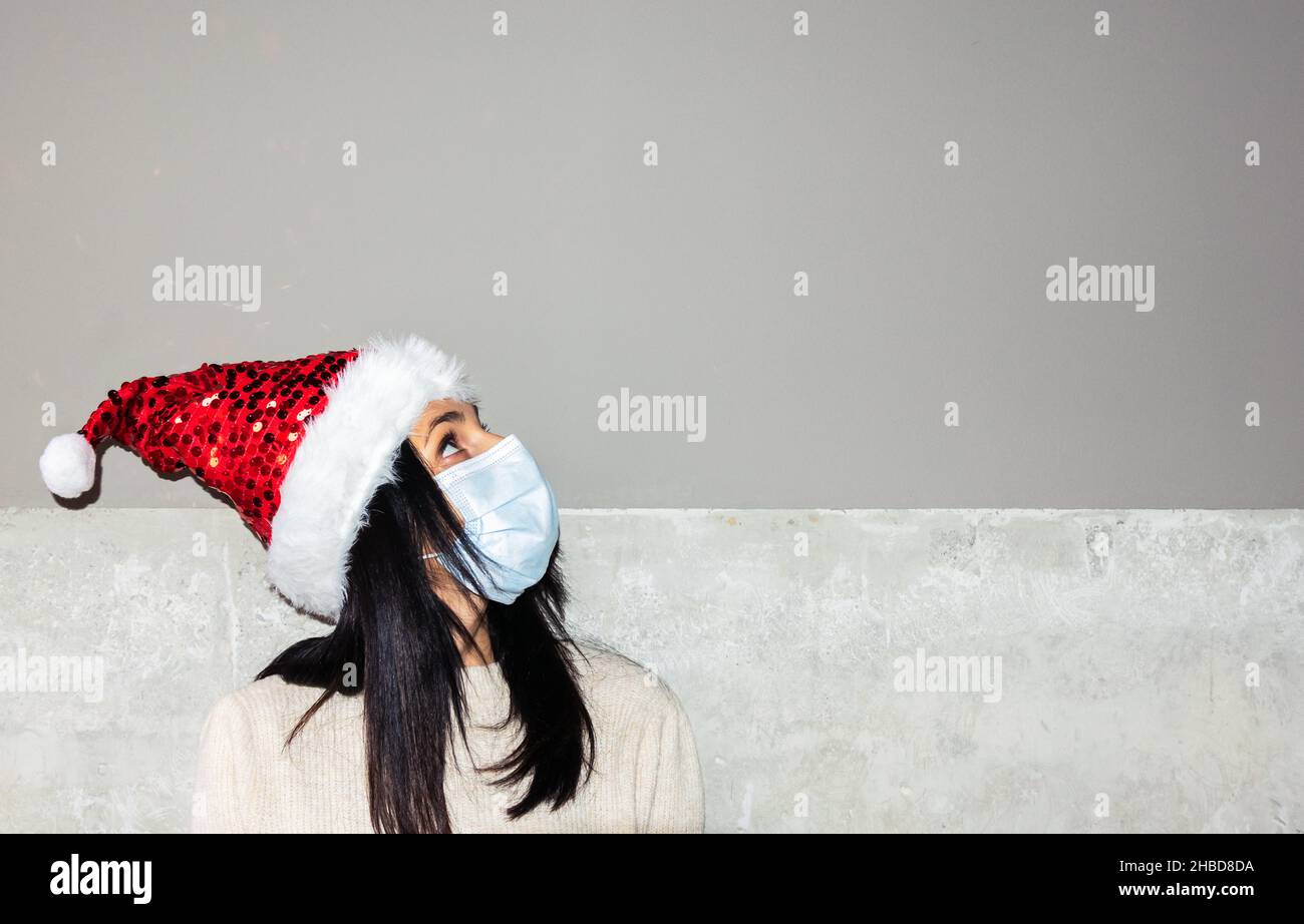 Creative background of woman standing and llay to wall and look up to ...