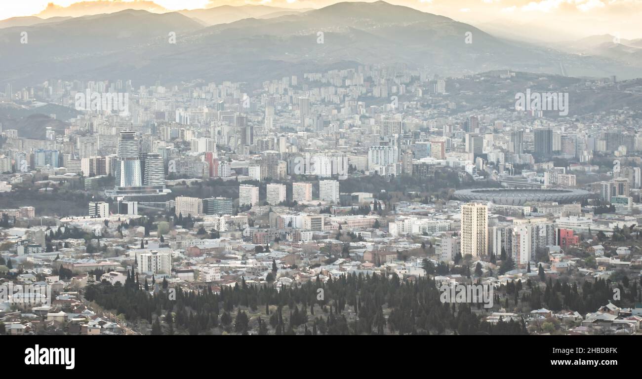 Aerial view to Tbilisi city buildings from far distance with caucasus ...