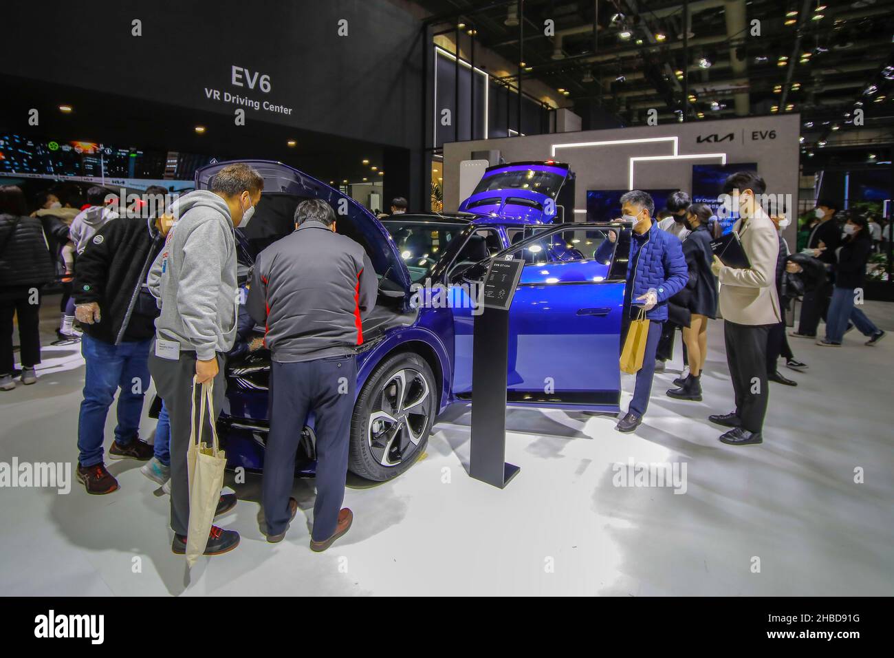 Nov 30, 2021-Goyang, South Korea-Visitors look KIA EV-6 system about ...