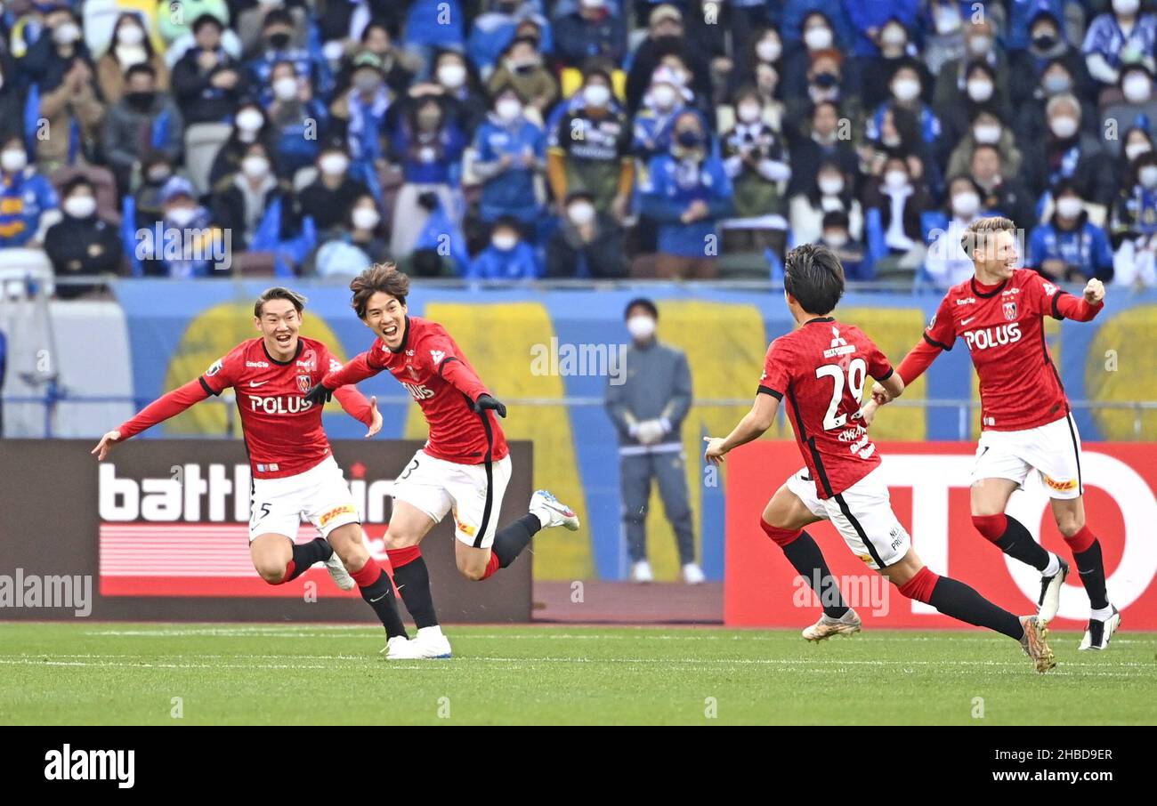 Ataru Esaka of Urawa Reds (2nd from L) reacts after opening the scoring ...