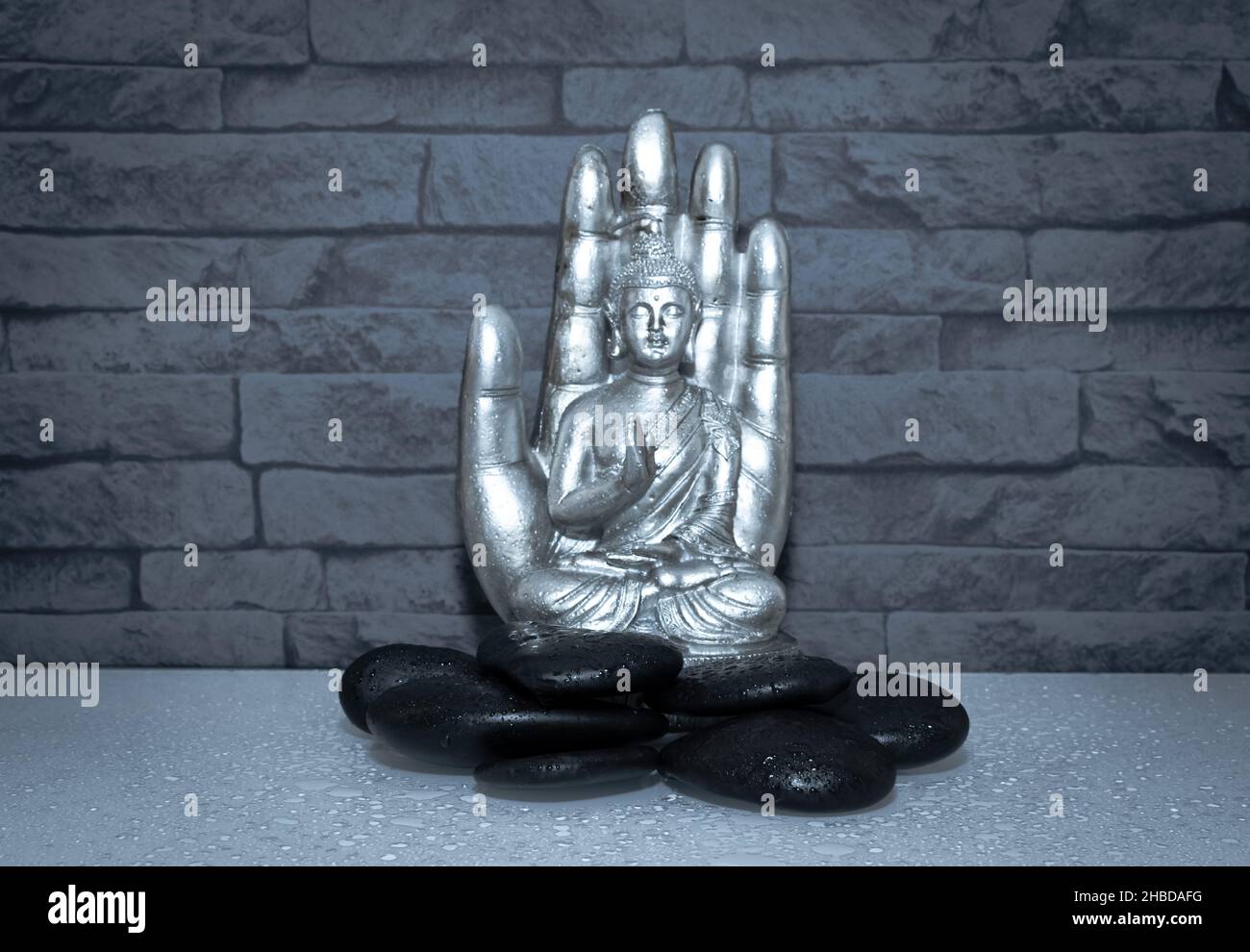 Buddha statue on a stone background Stock Photo - Alamy
