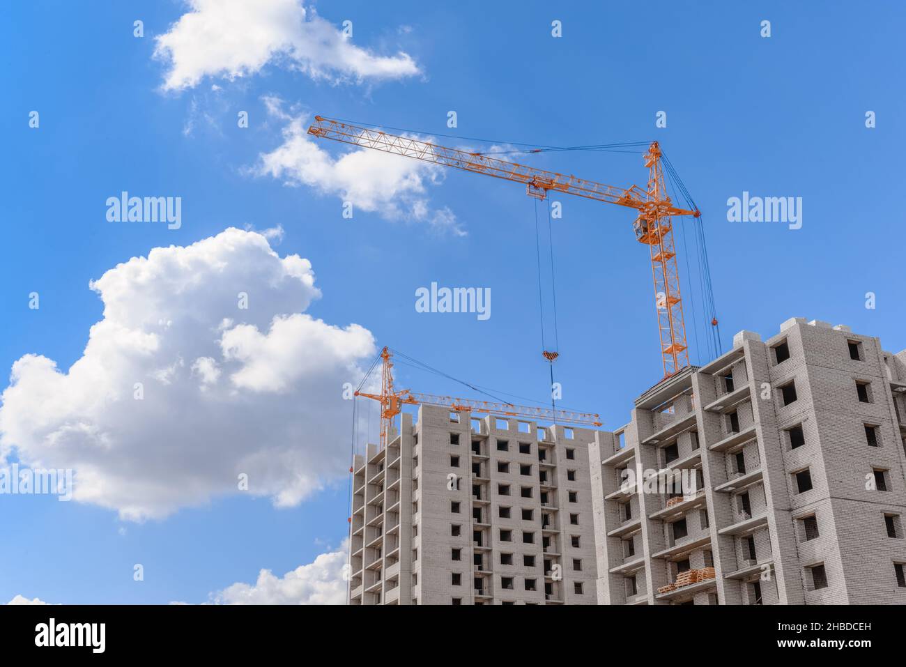 High-rise houses and construction cranes Stock Photo - Alamy