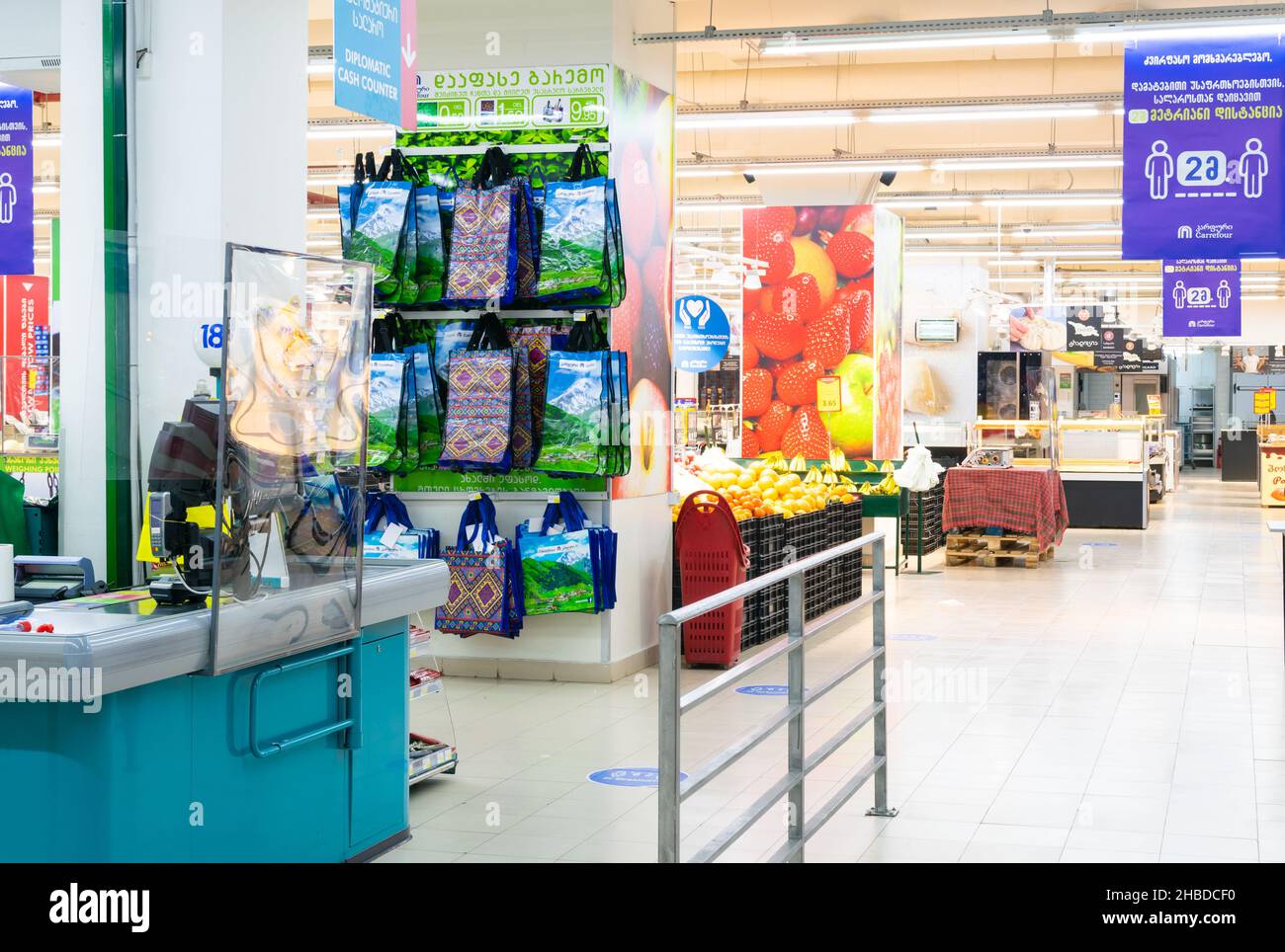 Cash desks with protective transparent shields in shop facility of ...