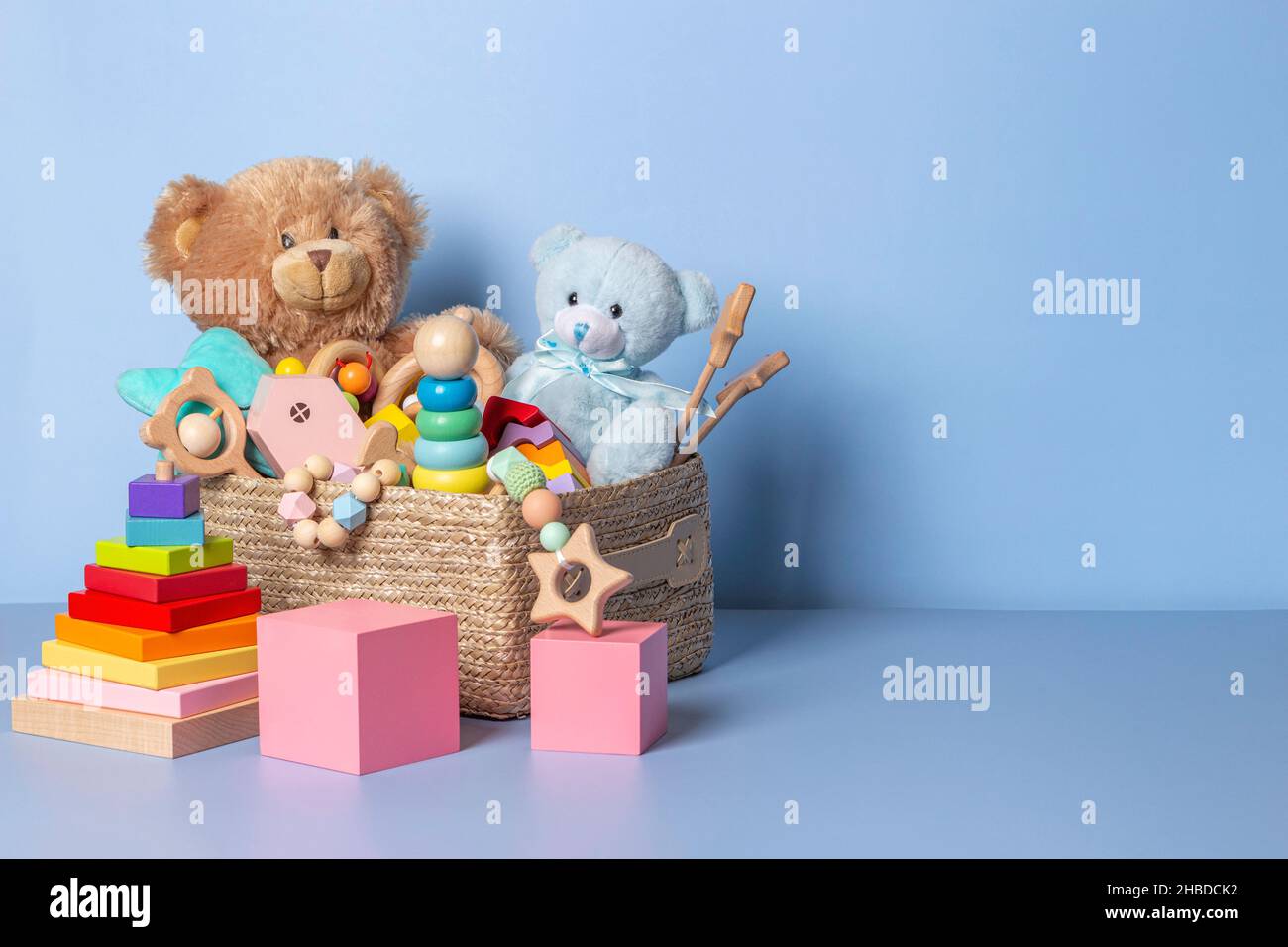 Toy box full of baby kid toys. Container with teddy bear, wooden ...