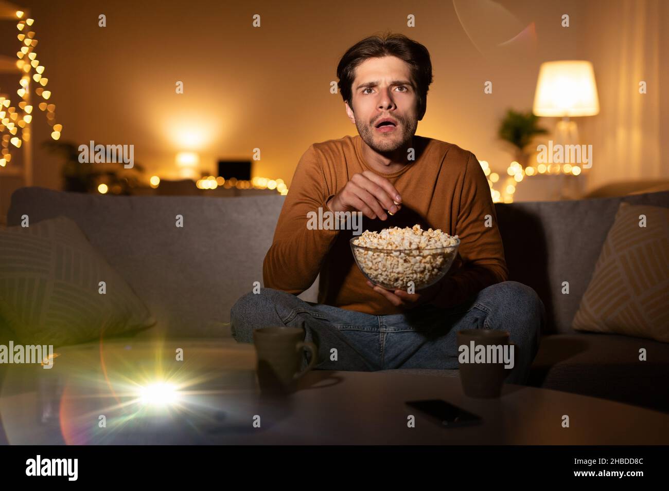 Shocked Man Watching Movie Using Domestic Cinema Projector At Home ...