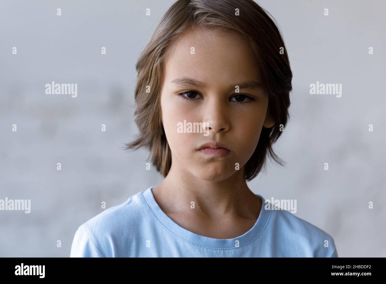 Head shot portrait of angry teenage kid boy Stock Photo - Alamy