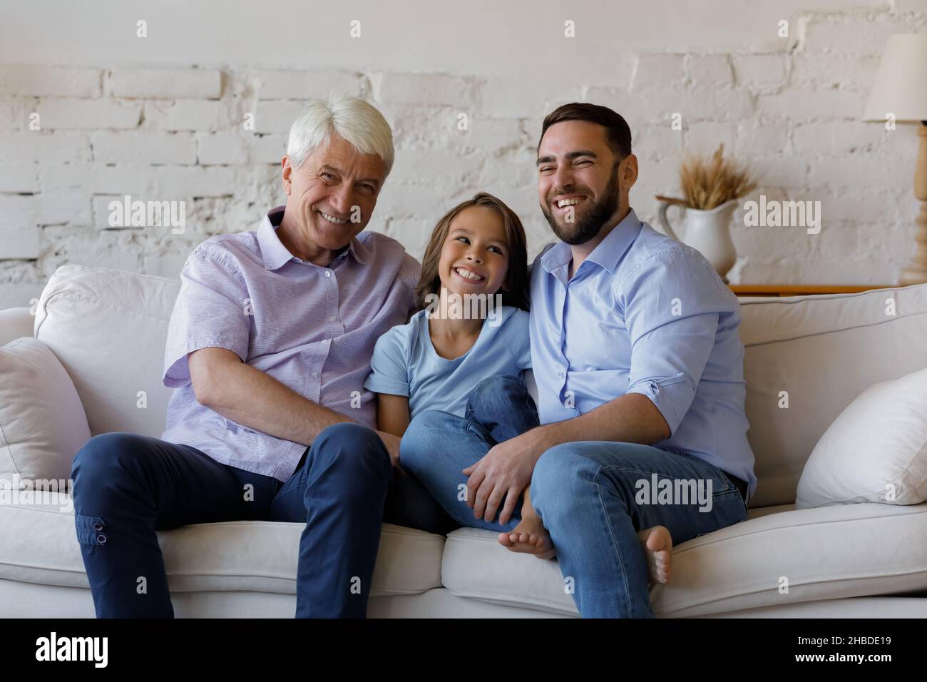 Happy three male generations family talking at home Stock Photo - Alamy