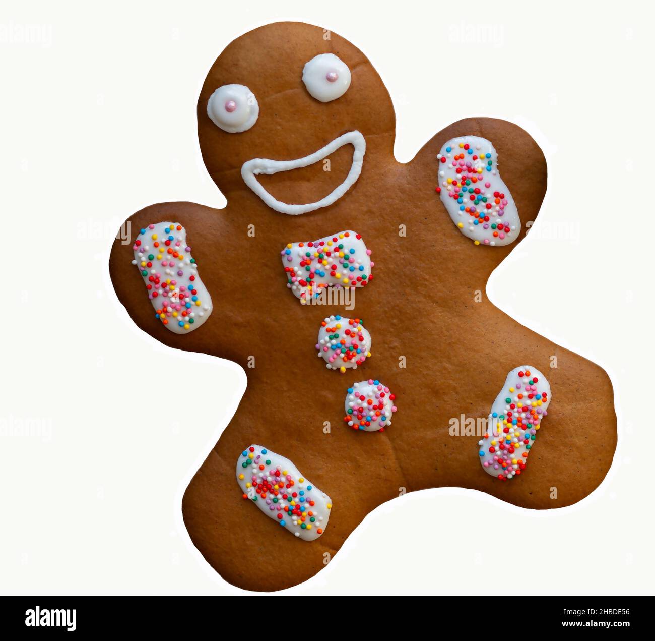 Isolated brown gingerbread man glazed with icing and decorated with ...