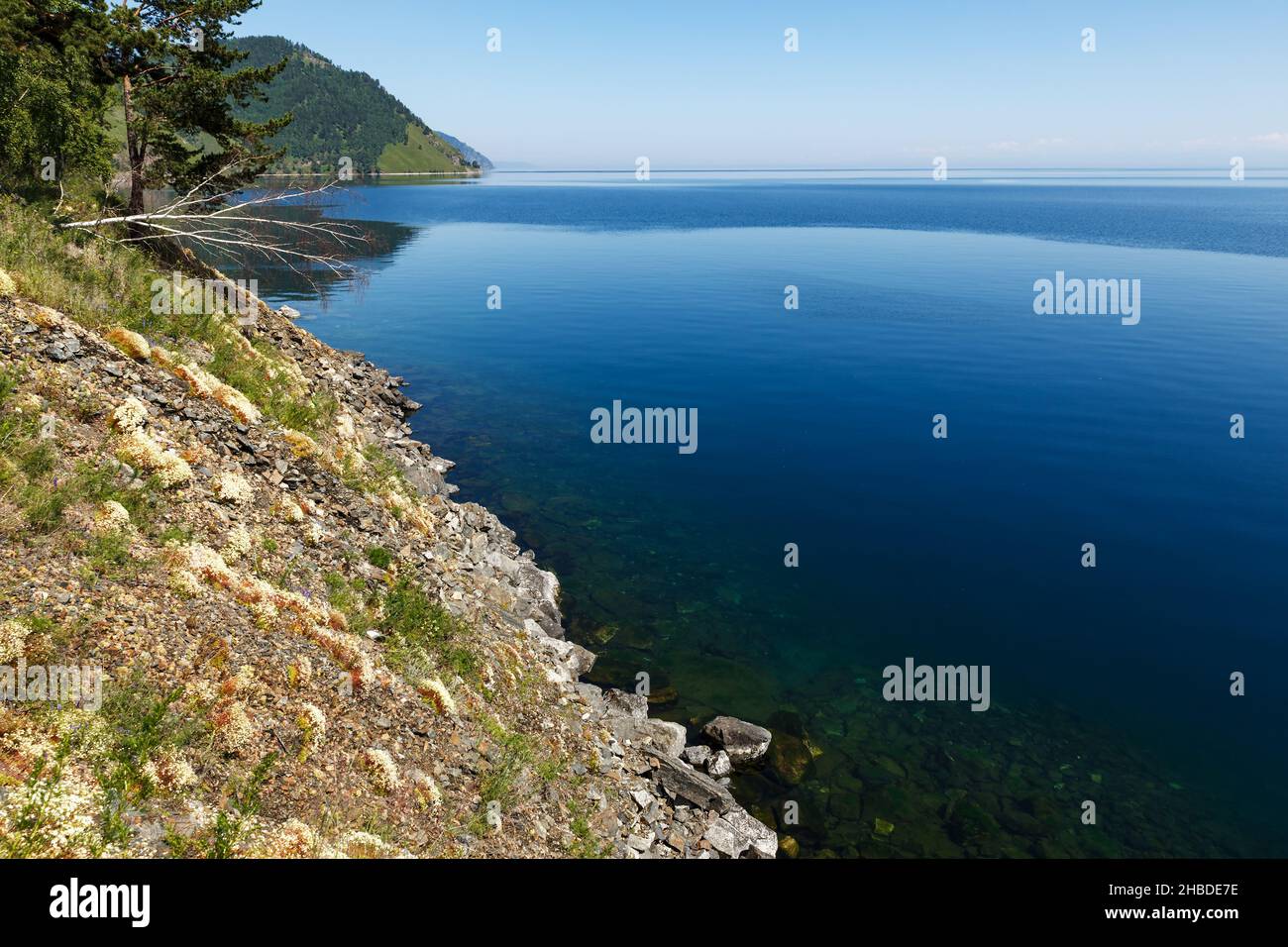 Lake Baikal, Russia. Rocky steep shore on the lake and clear water ...