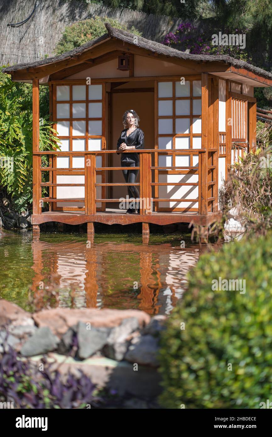 A Caucasian girl in Asian costume in a garden Stock Photo - Alamy
