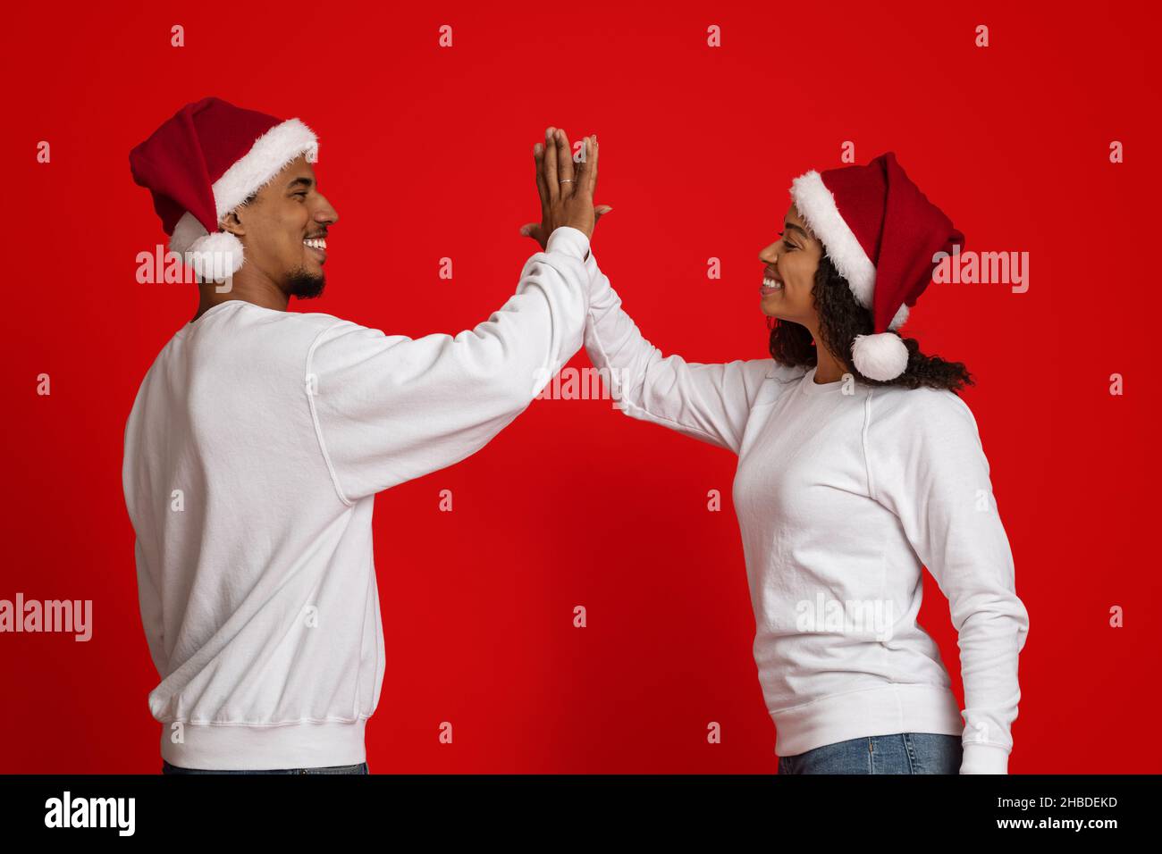 african american man and woman giving each other high five Stock Photo ...