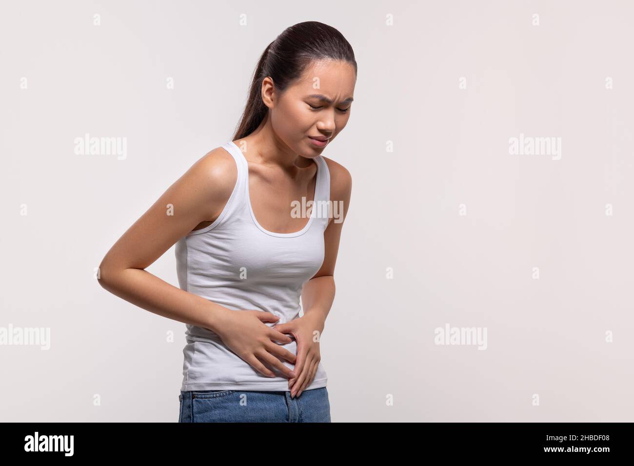 Sick chinese lady suffering from abdominal pain caused by diarrhea ...