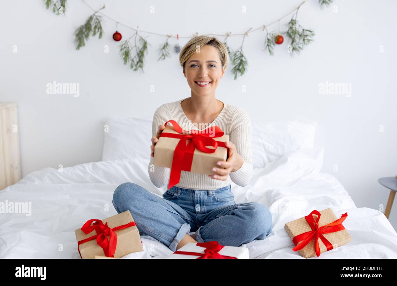 Pretty woman giving gift hi-res stock photography and images - Alamy