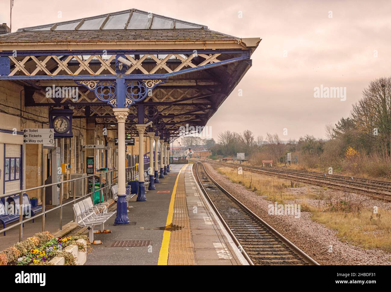A small town and country railway station. There is an 18th century iron ...