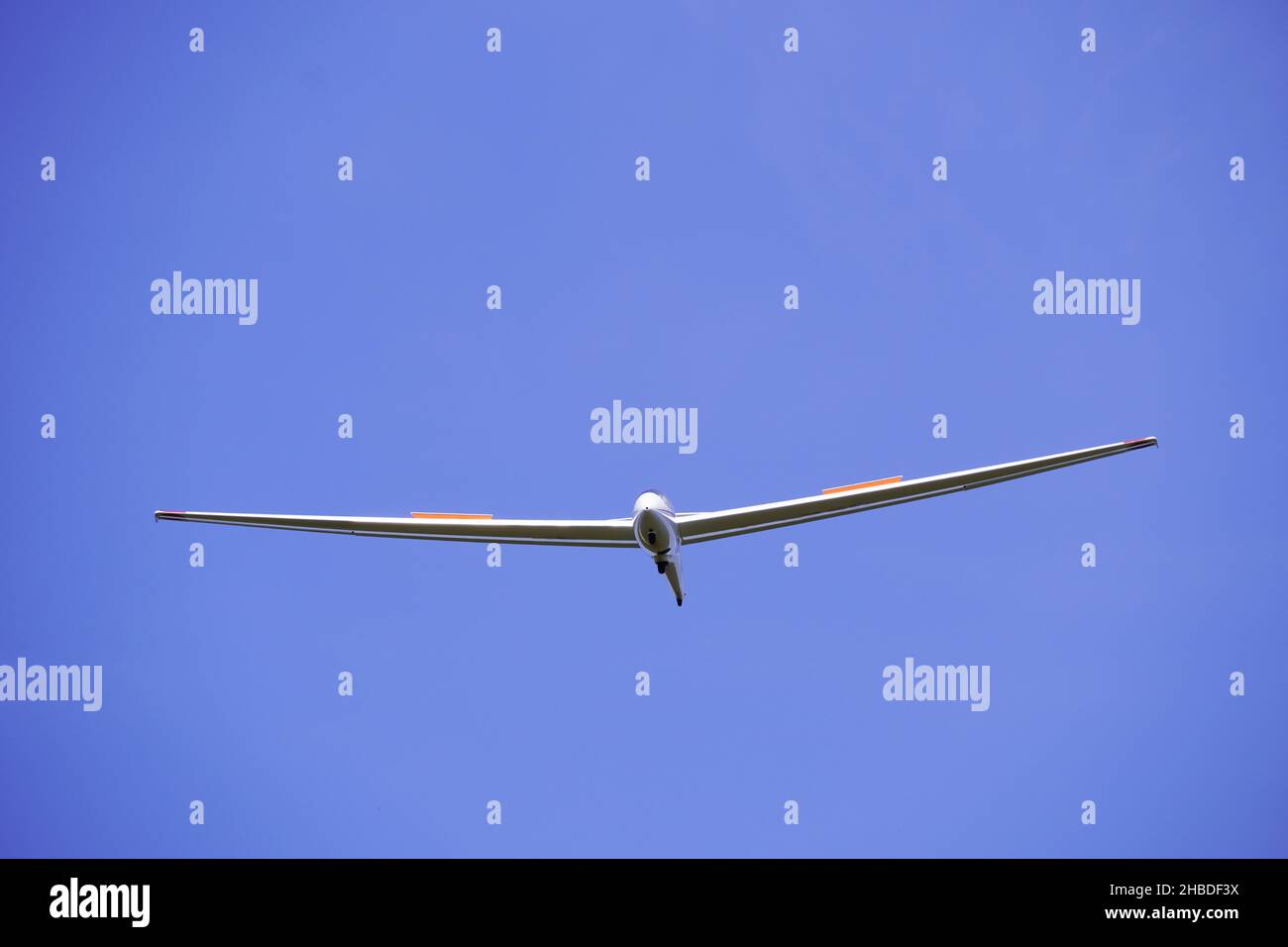 A low angle scenic view of the white glider in the sky Stock Photo - Alamy