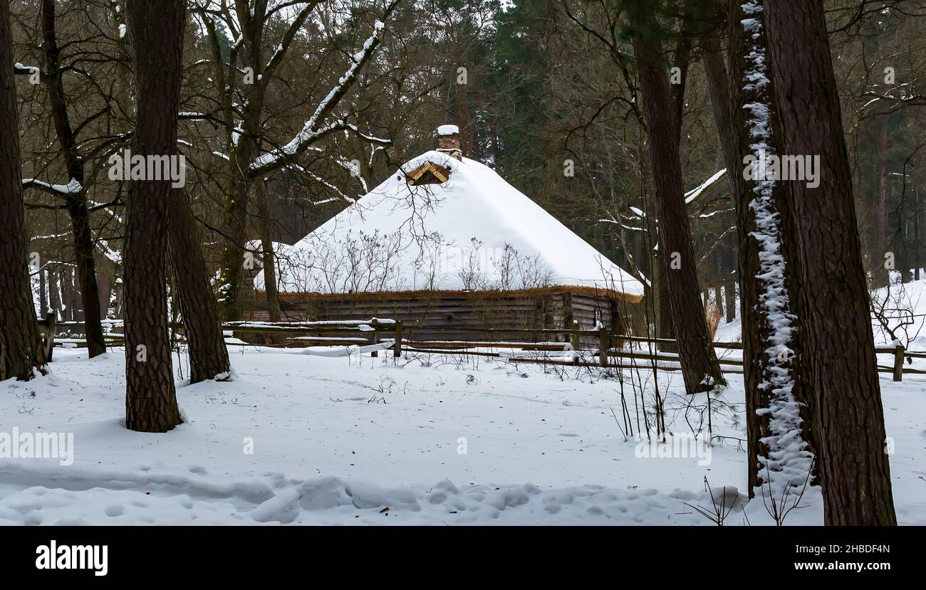 Old wooden log house covered with snow in a winter forest Stock Photo ...