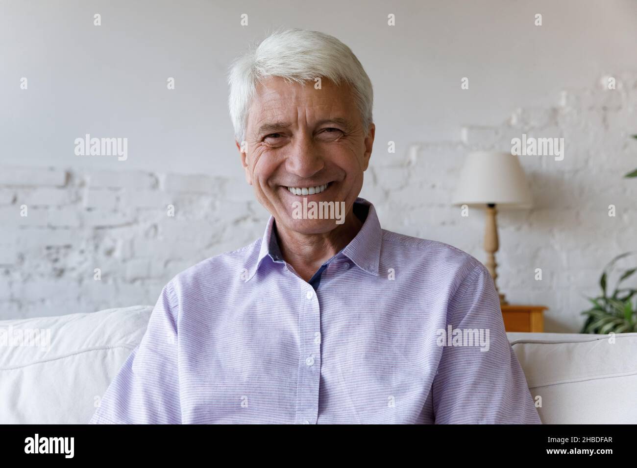 Portrait of smiling handsome old retired man Stock Photo - Alamy