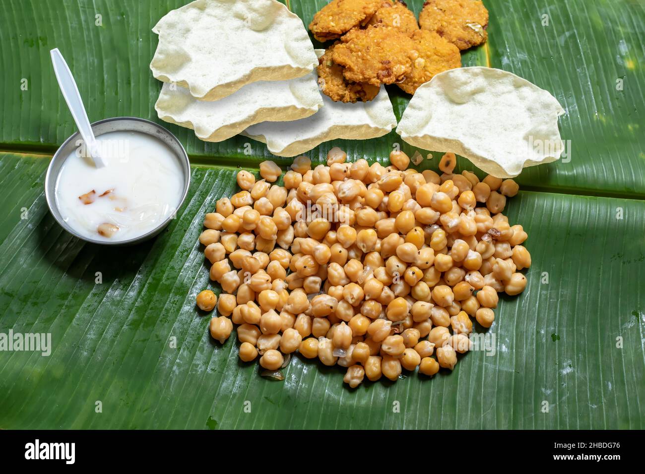 Traditional dish served on banana leaf on Indian festival day. It is ...