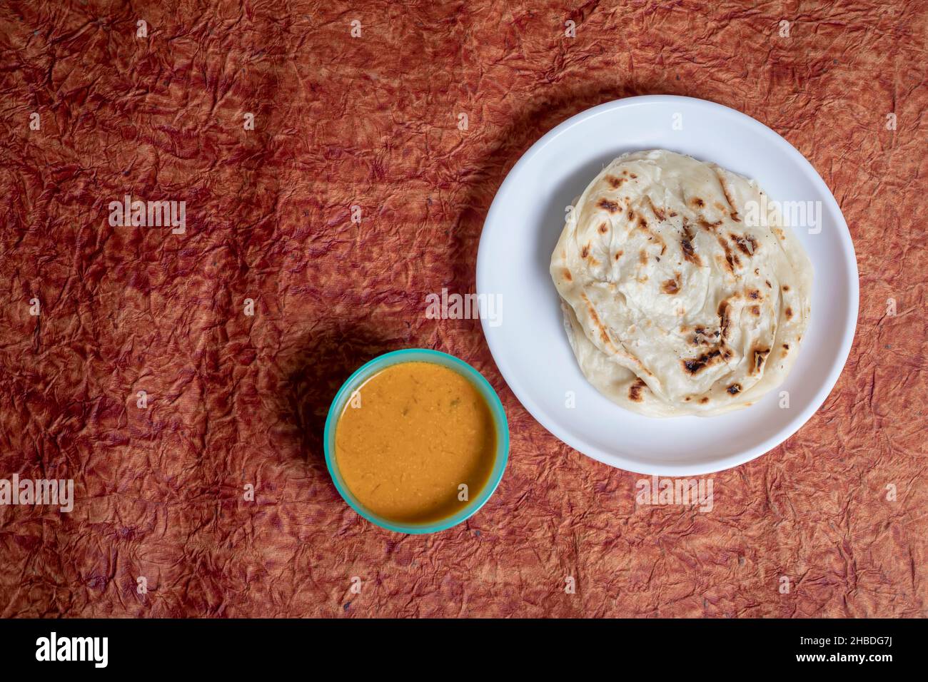 Porotta and chicken curry hi-res stock photography and images - Alamy