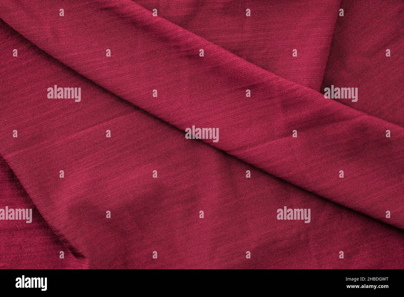 Luxurious romantic texture background of folded red color silk fabric ...