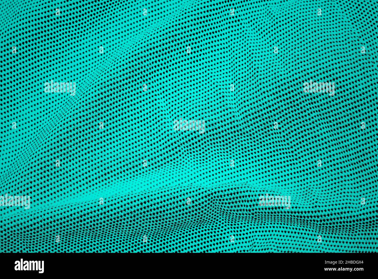 Cyan color linen fabric texture close up view with waves for background ...