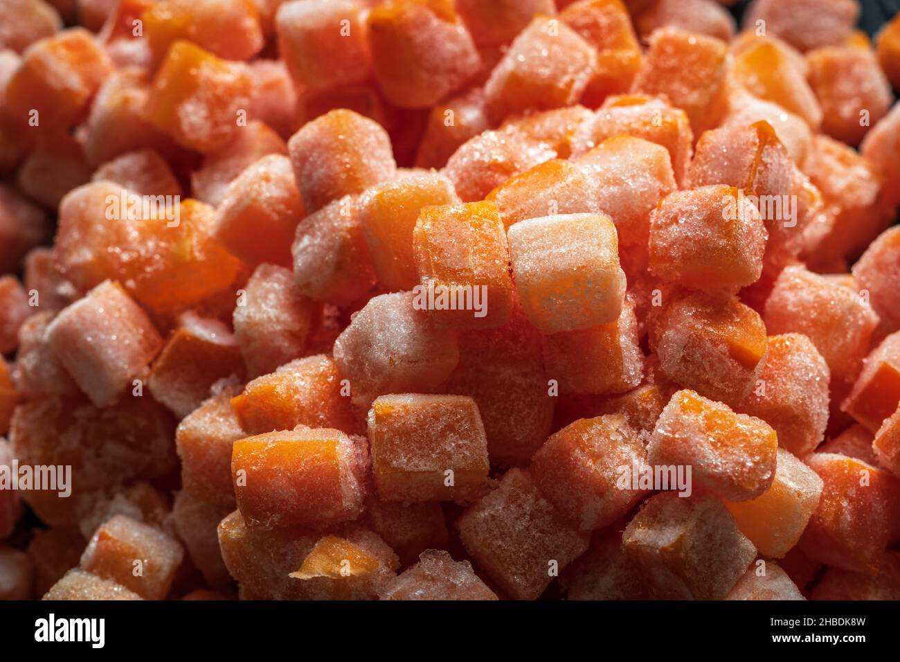 Frozen fresh carrot cube pieces closeup background Stock Photo - Alamy