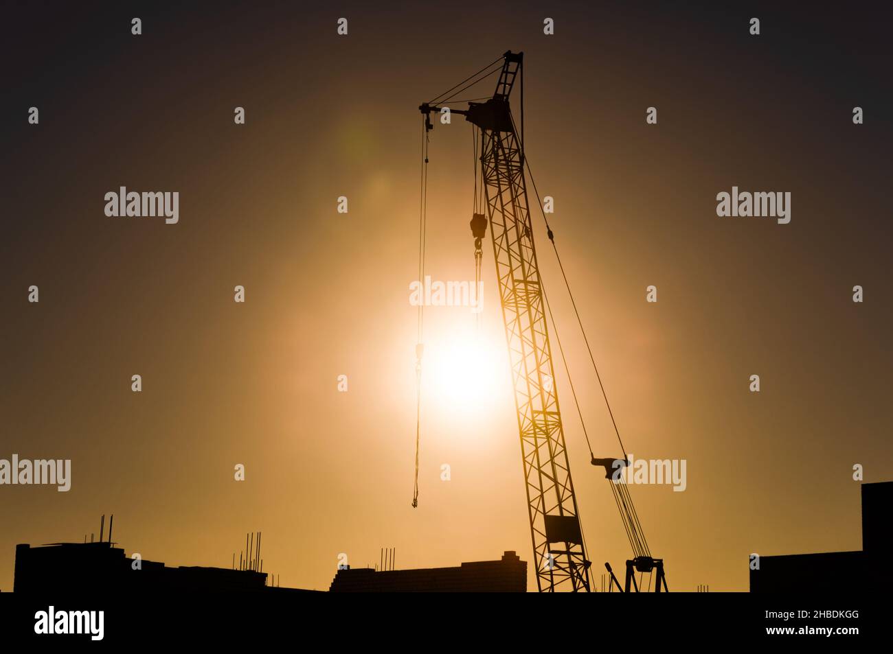 The construction crane on sunset Stock Photo - Alamy