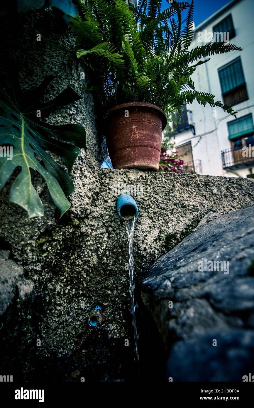 A view of water flowing down of the pipe Stock Photo - Alamy