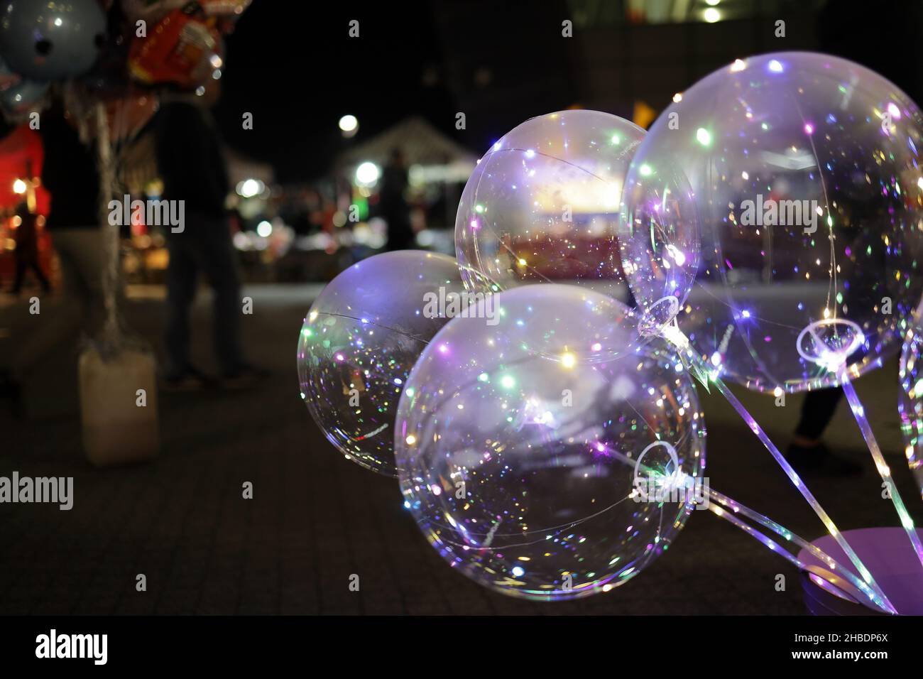 A bunch of big transparent balloons with lights Stock Photo - Alamy
