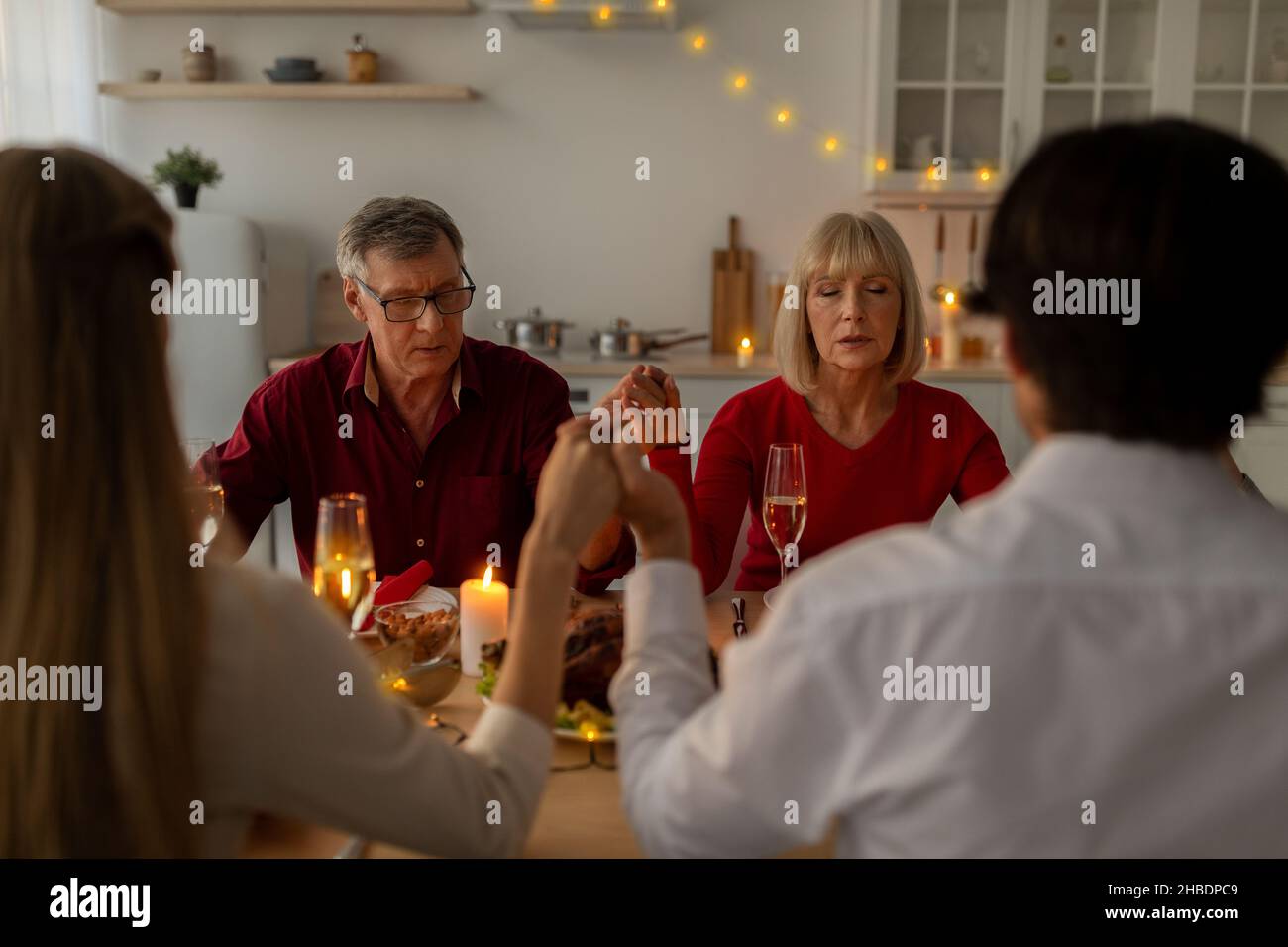 Millennial spouses celebrating Christmas with senior parents, praying ...