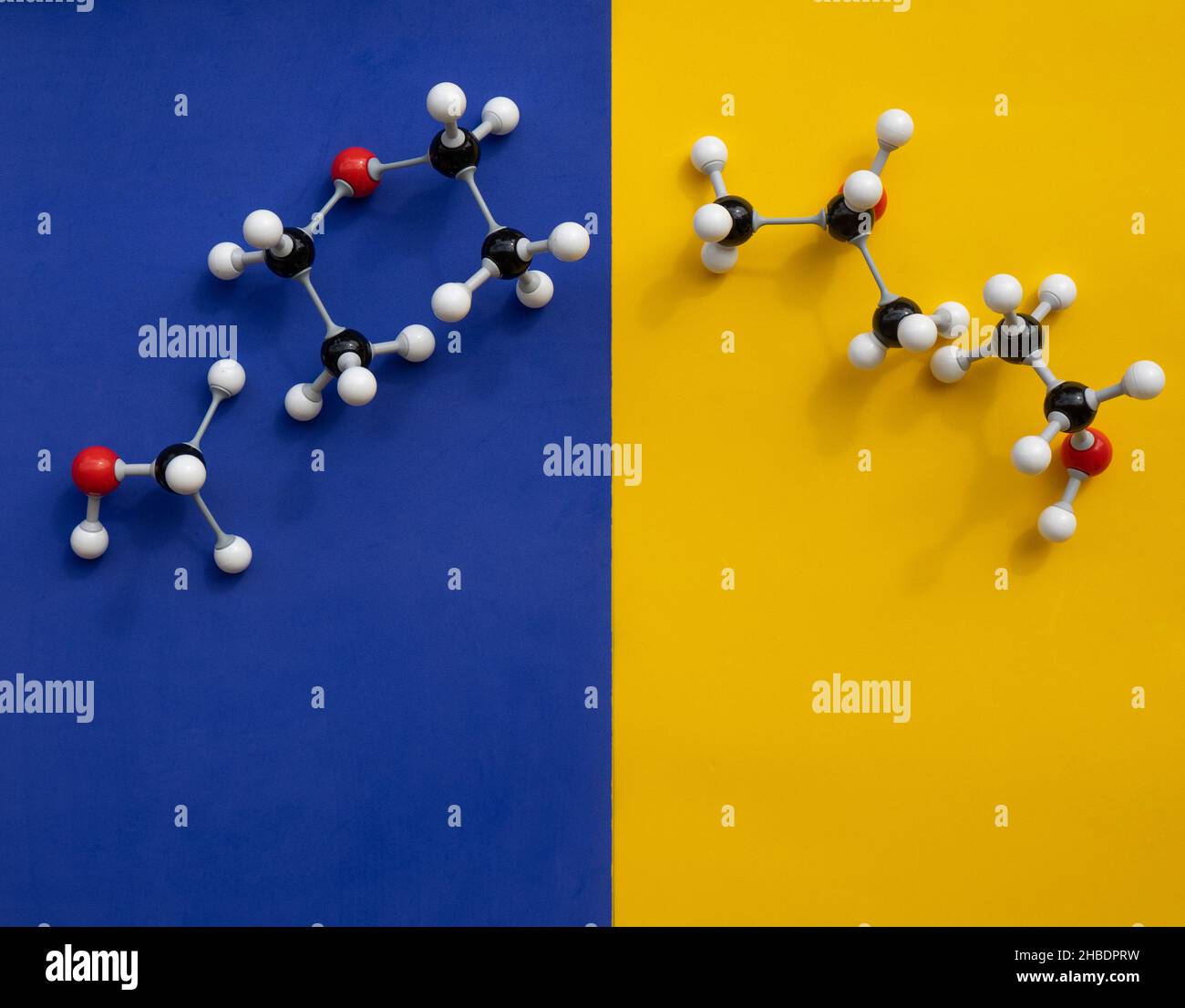 A top view of molecular atom models isolated on blue and yellow ...
