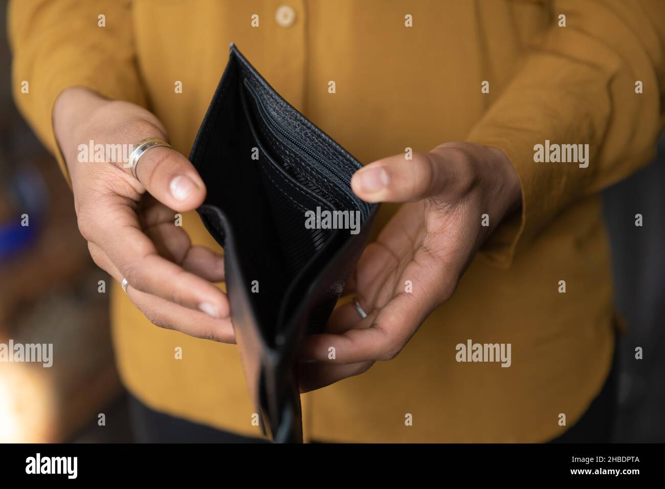 Close up young African American woman holding empty wallet Stock Photo ...
